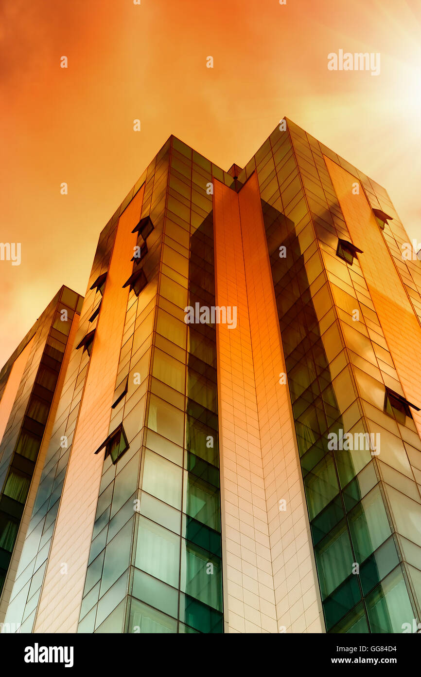 Office building illuminated by the sunset Stock Photo - Alamy
