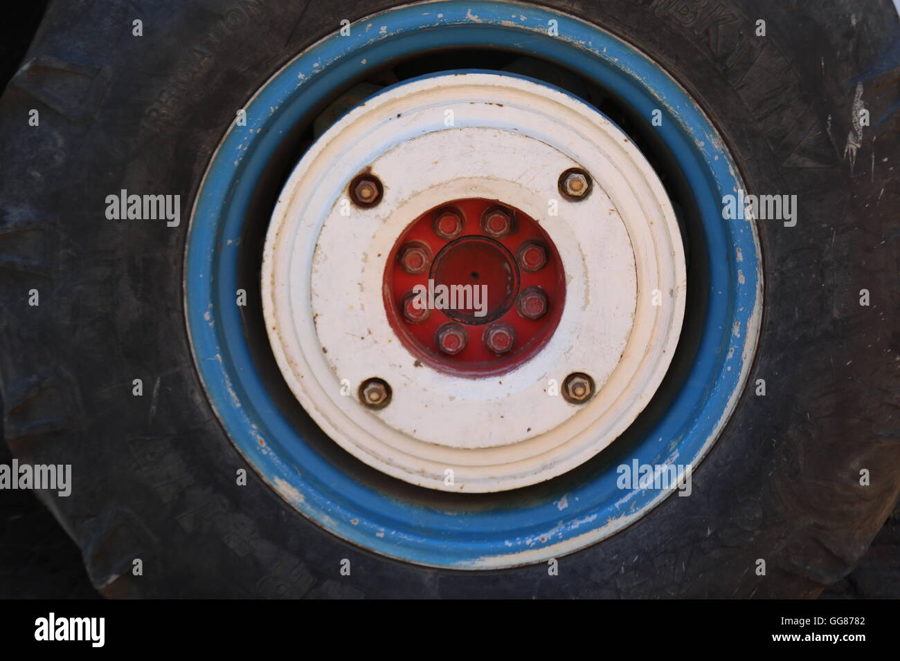 Tractor tire with blue and white inside Stock Photo - Alamy
