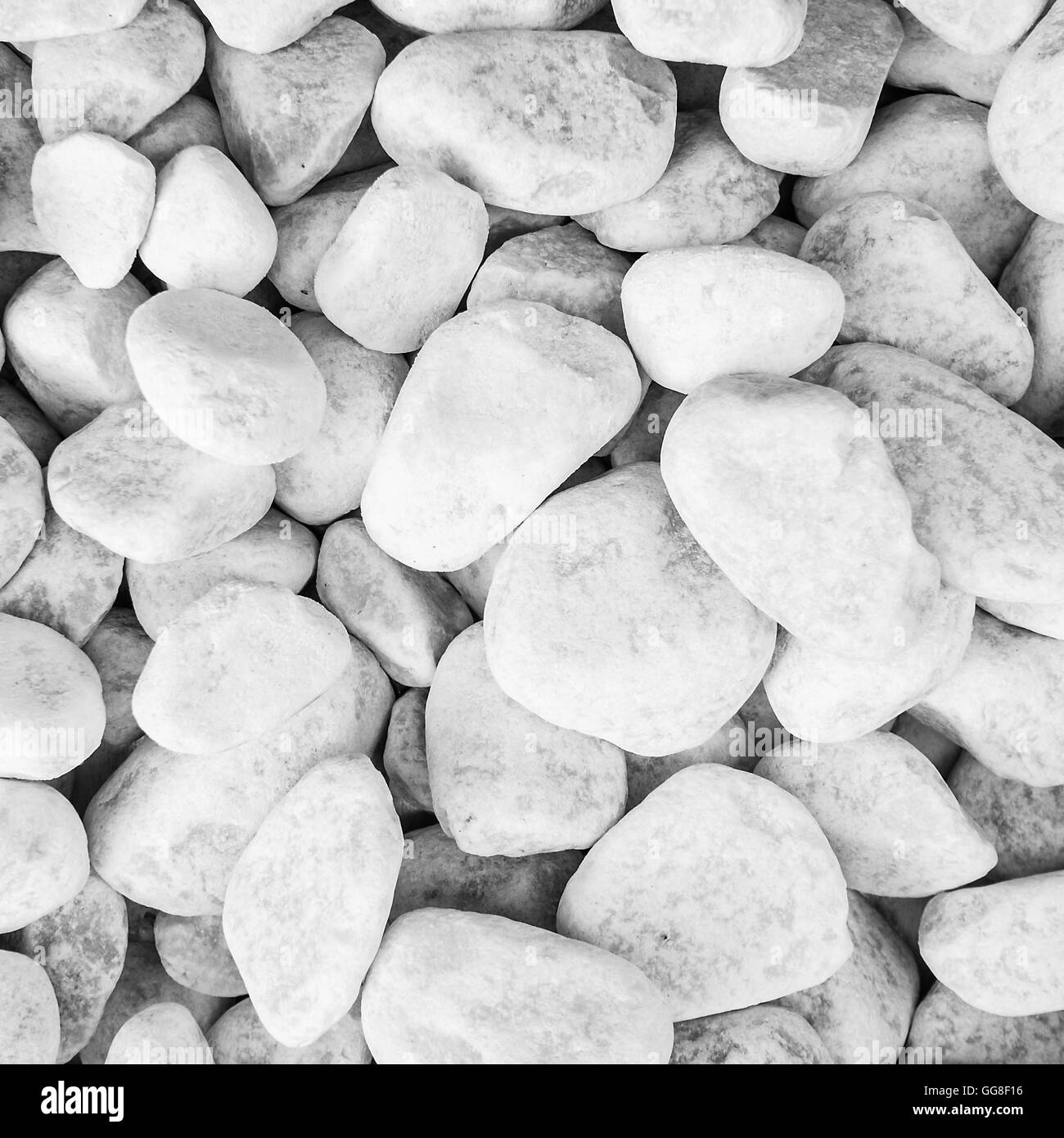 closeup of sidewalk made of many little round white pebble stones in ...