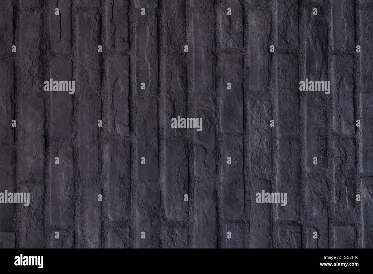 black rectangle brick mosaic in rectangle form with many irregularities ...