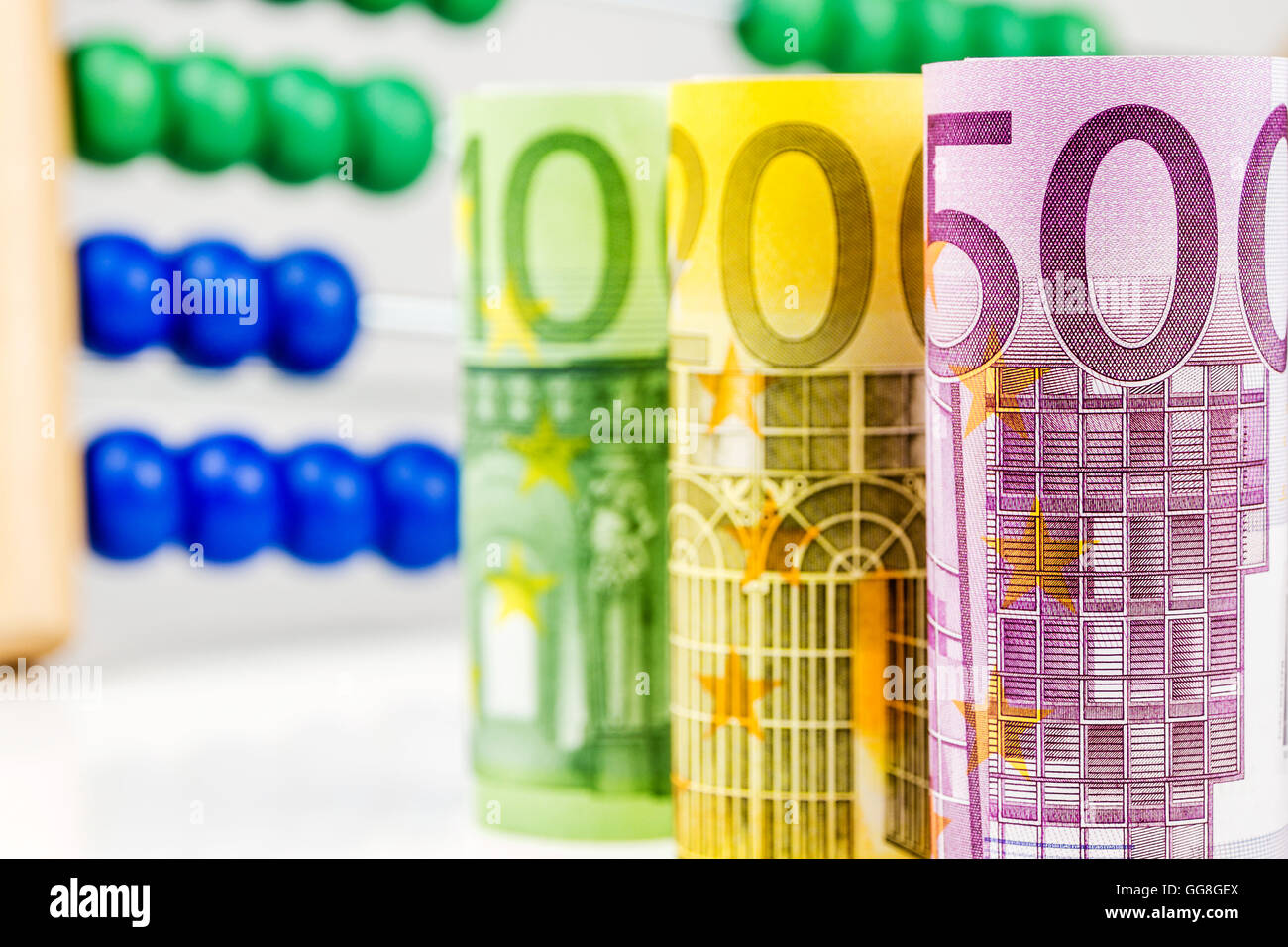 big euro banknotes with big wooden counter in the background as a ...