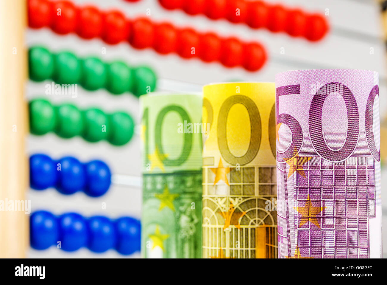 big euro banknotes with big wooden counter in the background as a ...