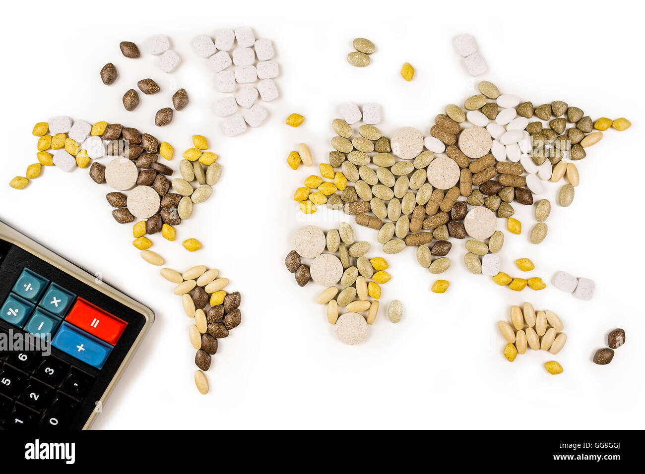various vitamin supplements forming map of the world on white ...
