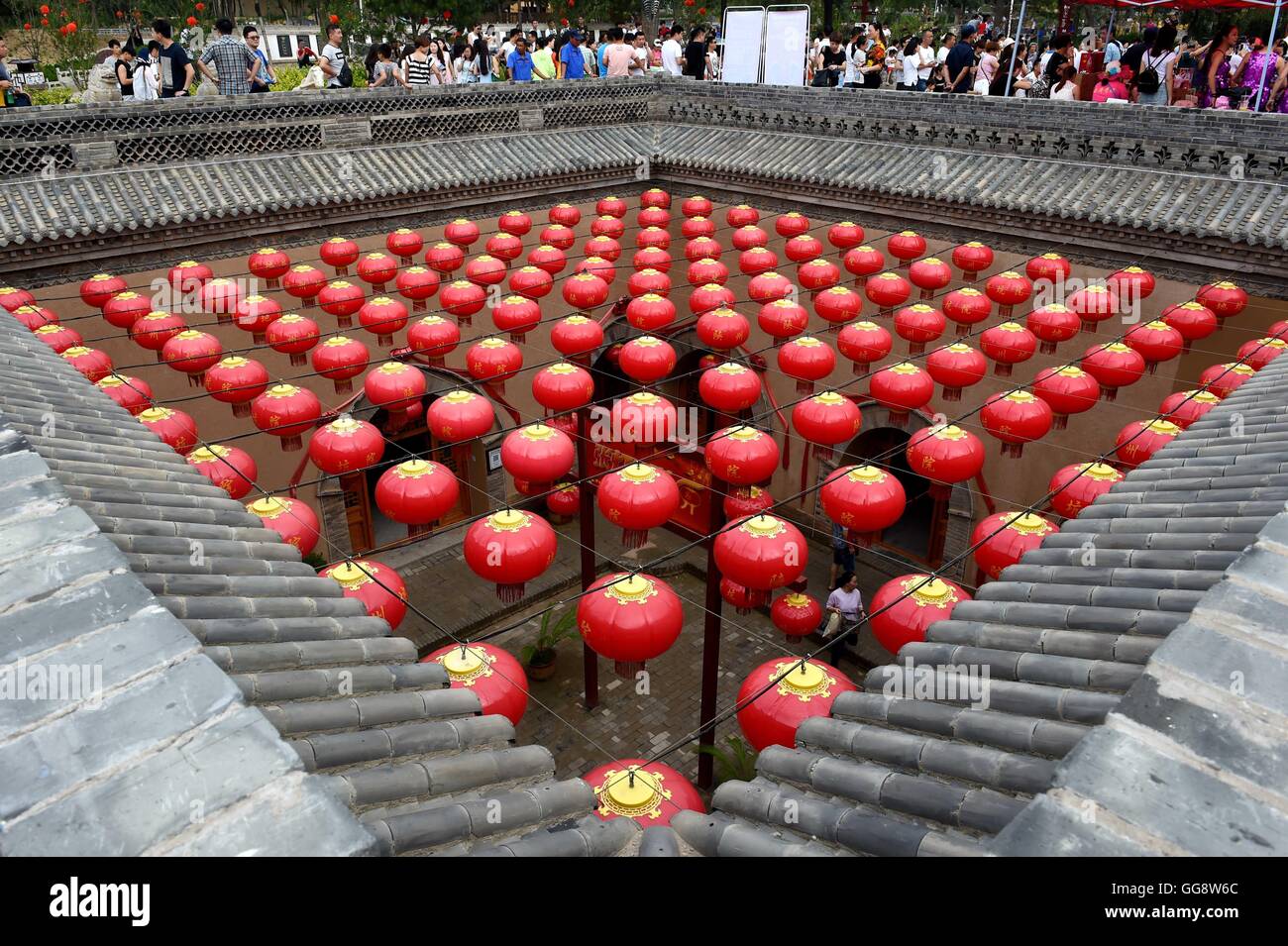 Sanmenxia. 10th Aug, 2016. Tourists visit an underground courtyard at ...
