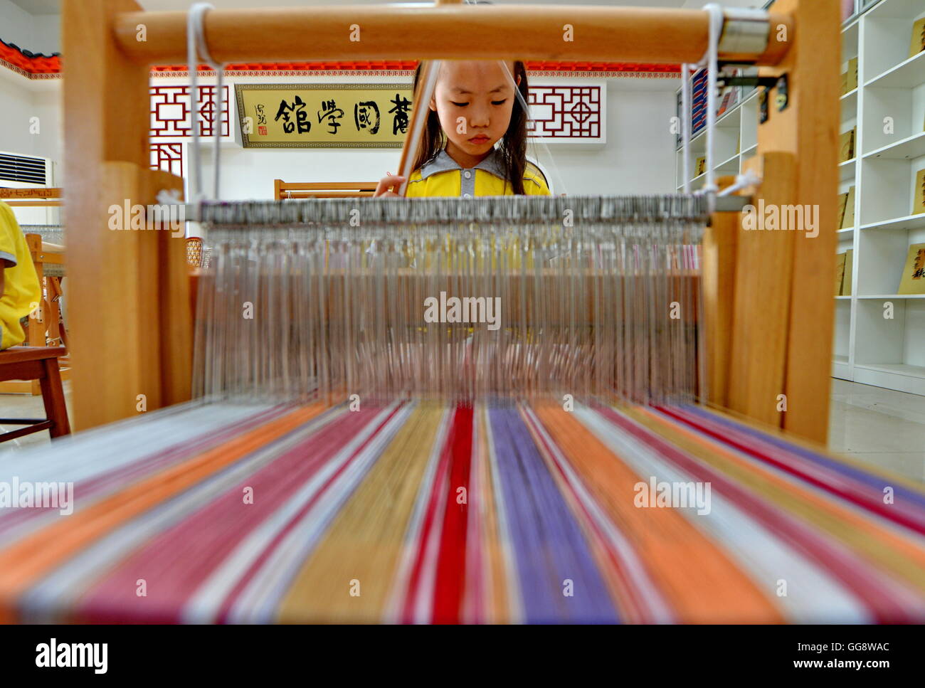 Xingtai, China's Hebei Province. 10th Aug, 2016. A girl learns hand ...