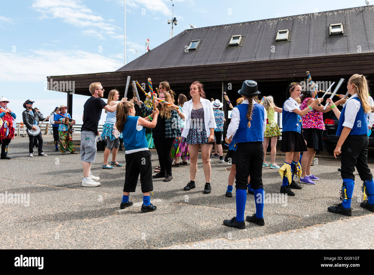 Women, both from Morris sides and members of the public, dancing the ...