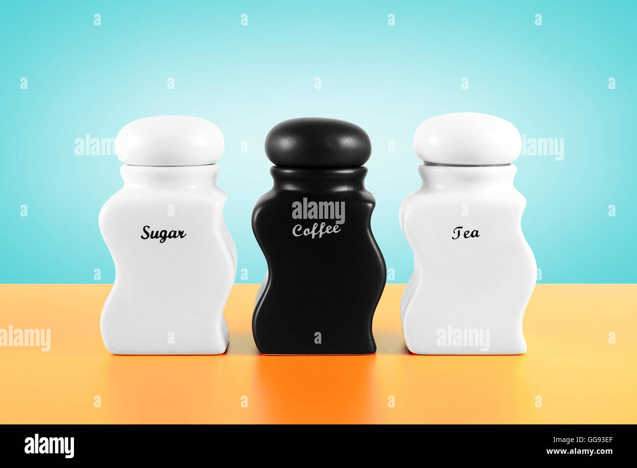 Capacities for condiment spices - Sugar, coffee, tea a set on an orange ...