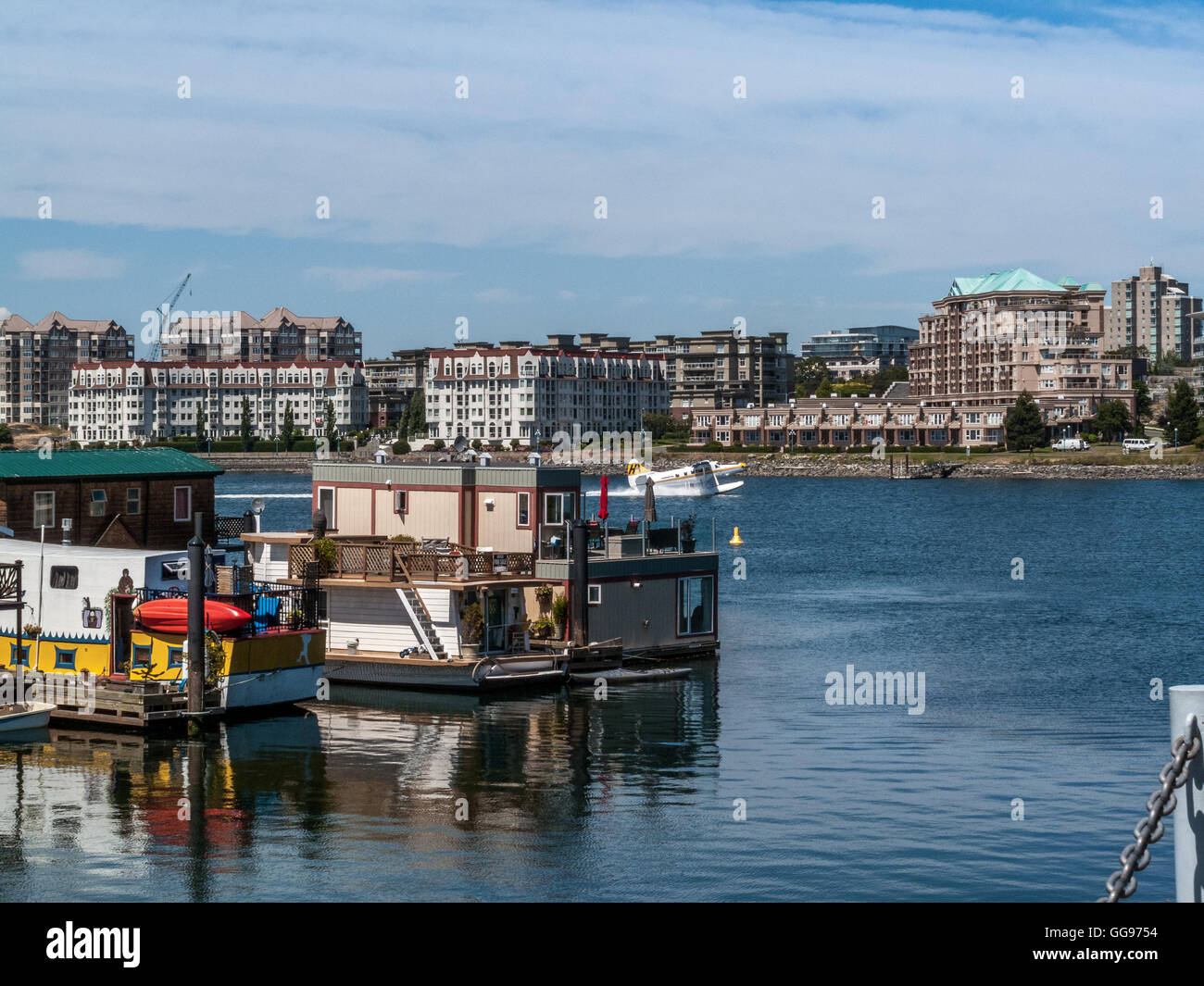 Boat houses at Fisherman wharf with apartments buildings in background ...