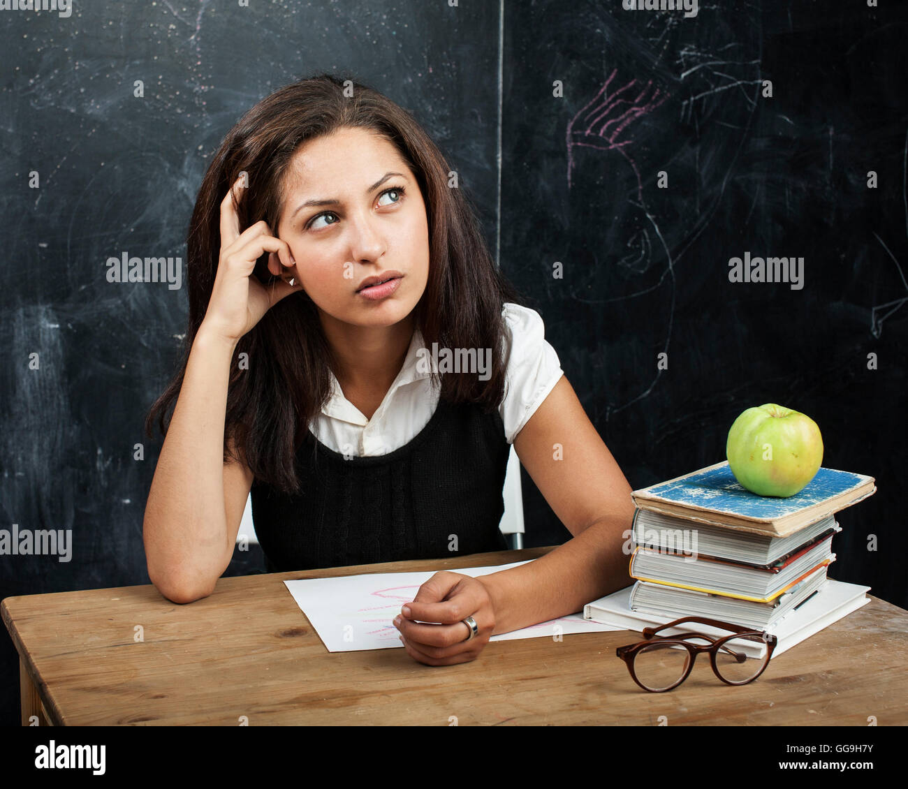 portrait of happy cute student in classroom at blackboard back to ...