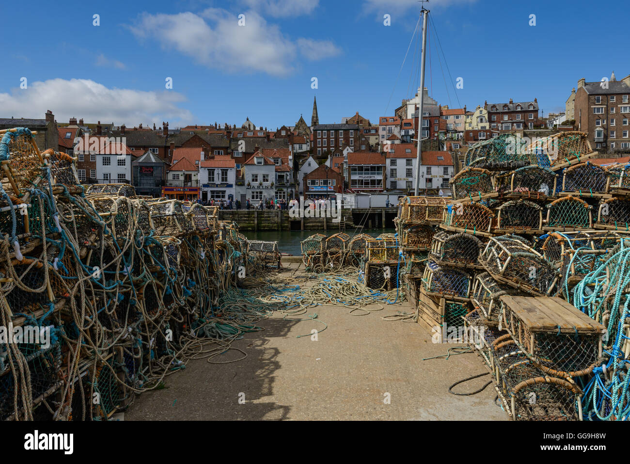 Stacks of lobster and crab pots drying in the sun in Whitby, a seaside ...