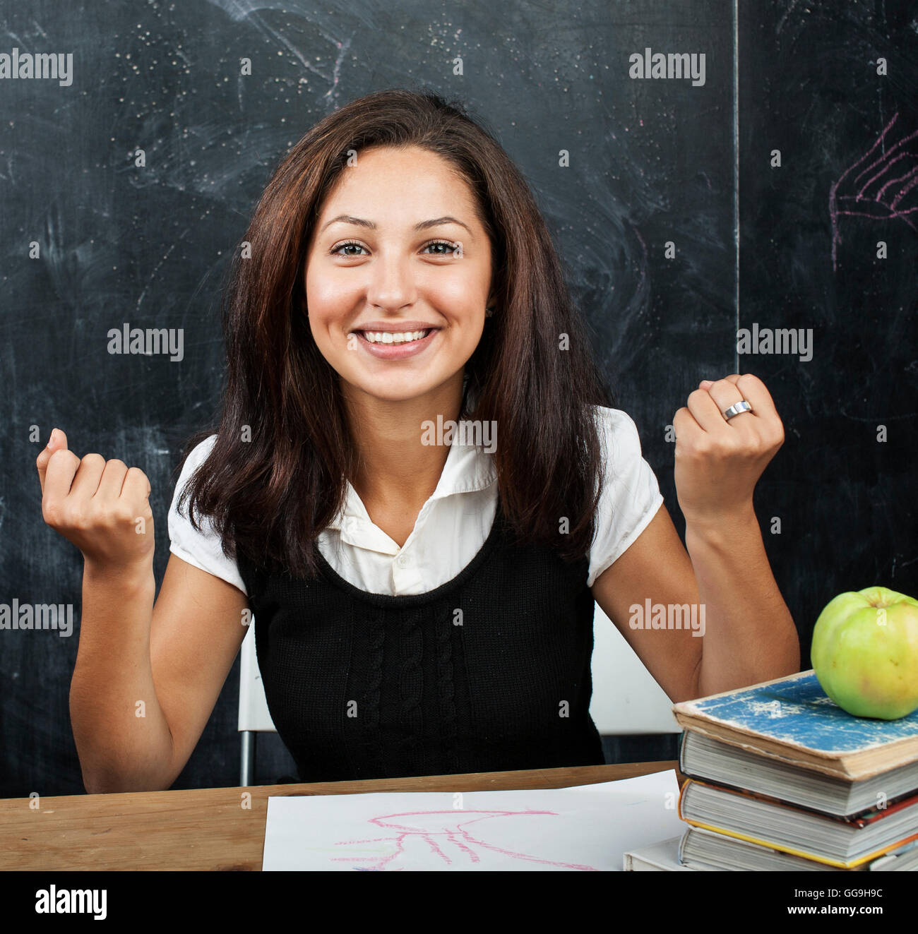 portrait of happy cute student in classroom at blackboard back to ...