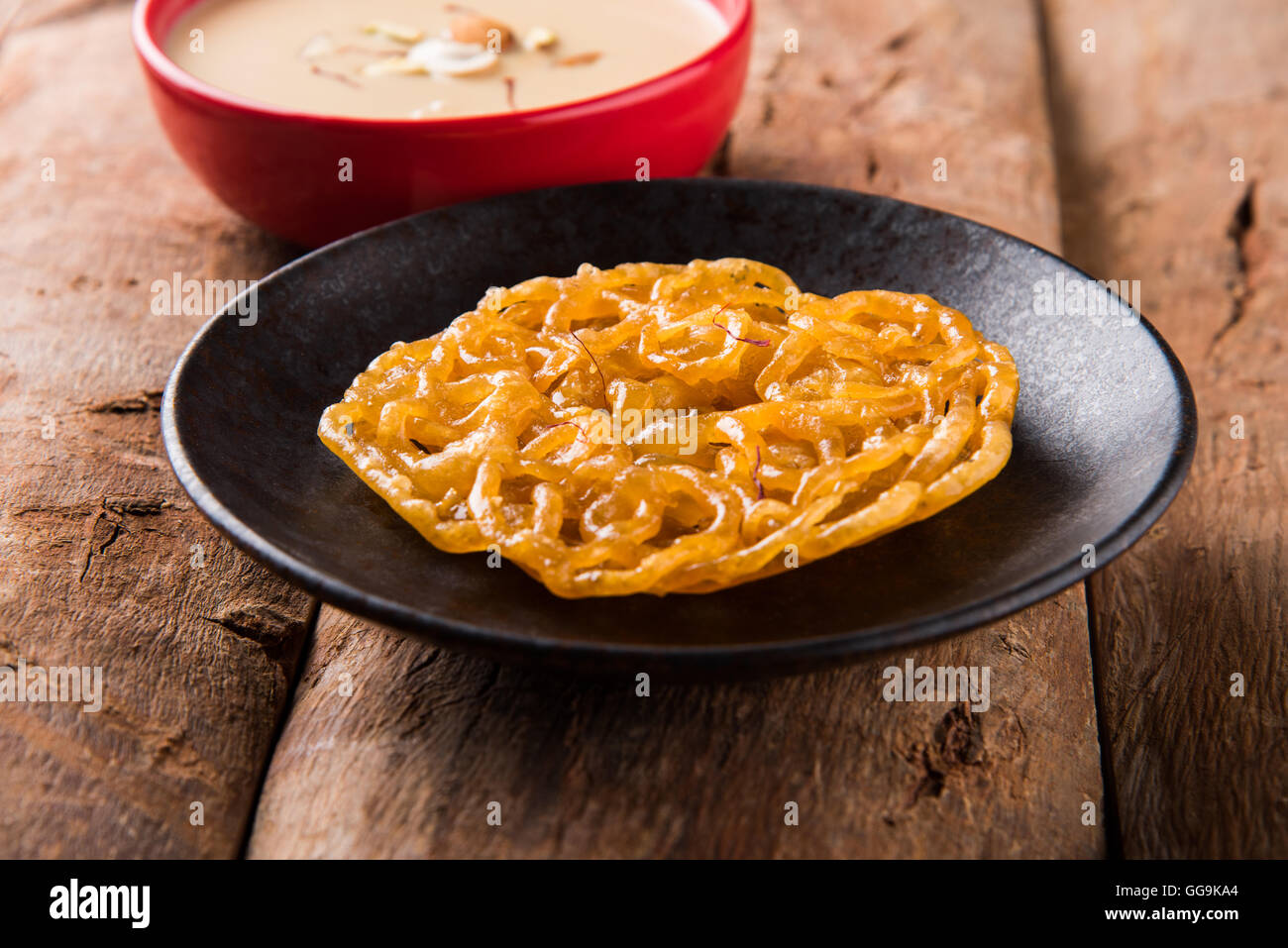 jalebi or imarati with rabdi made from condensing milk, famous dessert ...