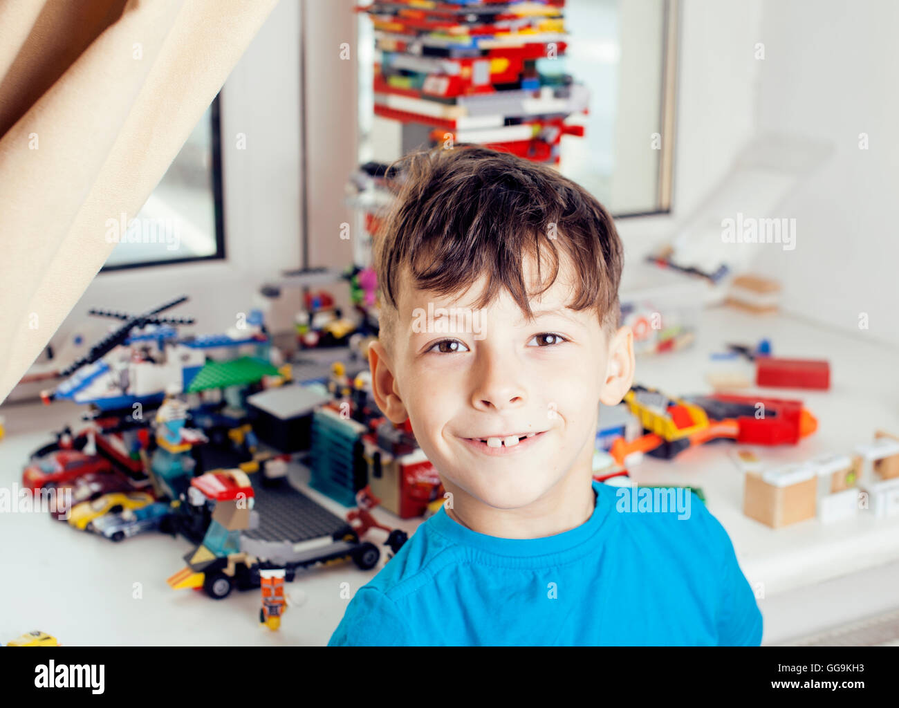 little cute preschooler boy playing lego toys at home happy smiling ...