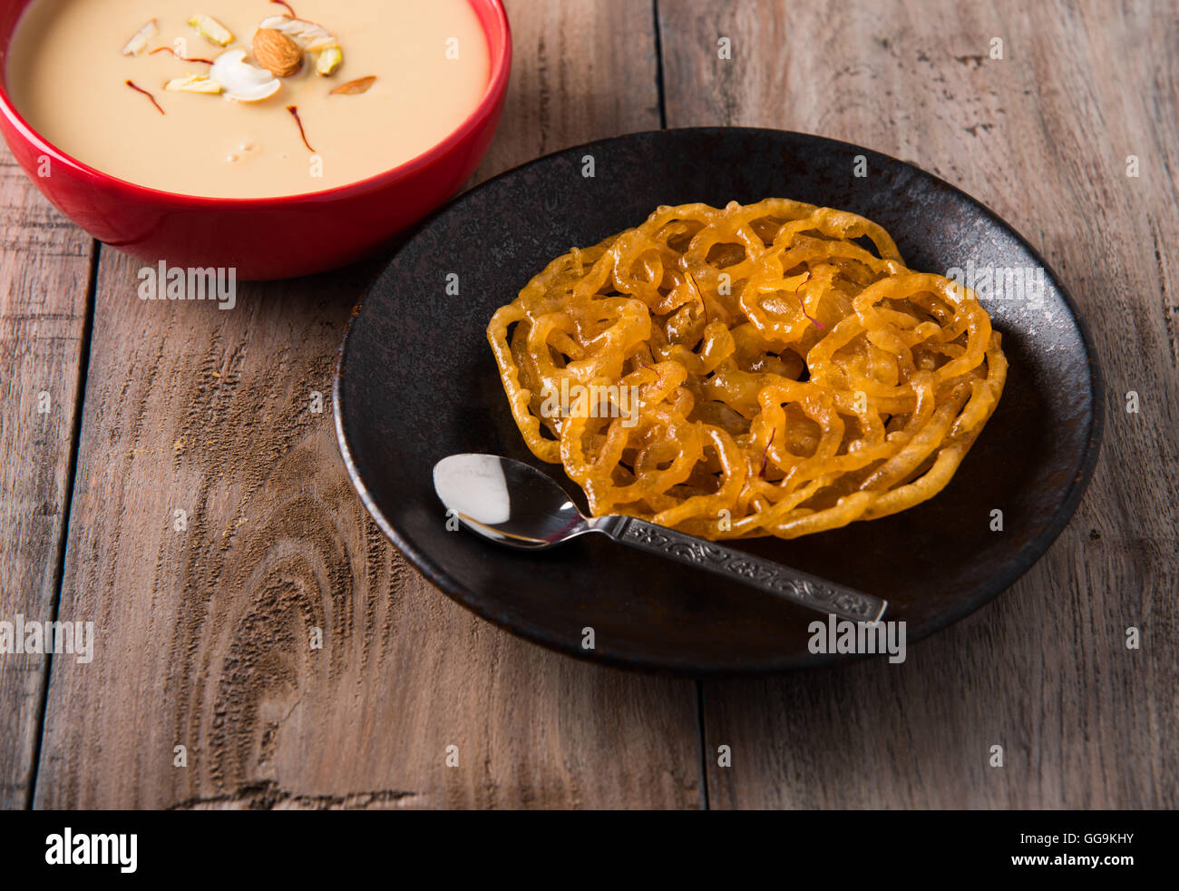 jalebi or imarati with rabdi made from condensing milk, famous dessert ...
