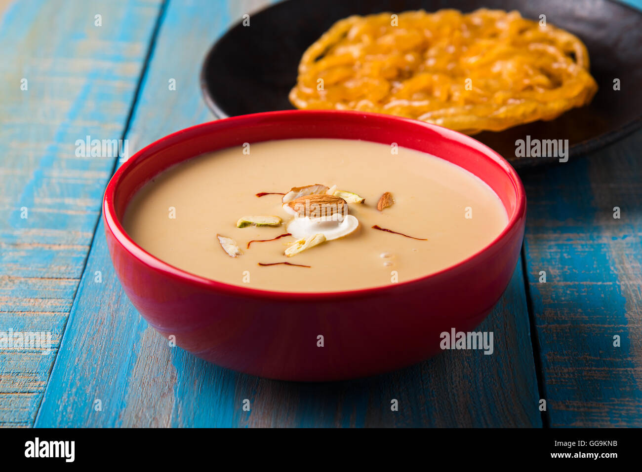 jalebi or imarati with rabdi made from condensing milk, famous dessert ...