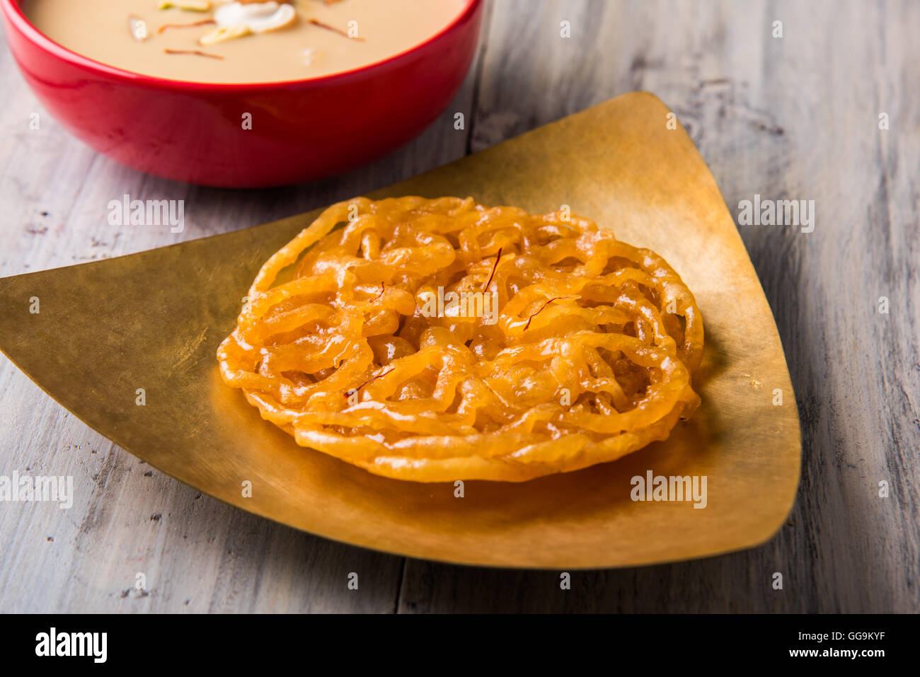 jalebi or imarati with rabdi made from condensing milk, famous dessert ...