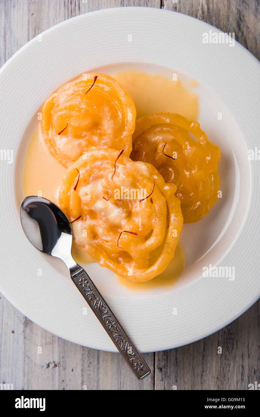 jalebi or imarati with rabdi made from condensing milk, famous dessert ...