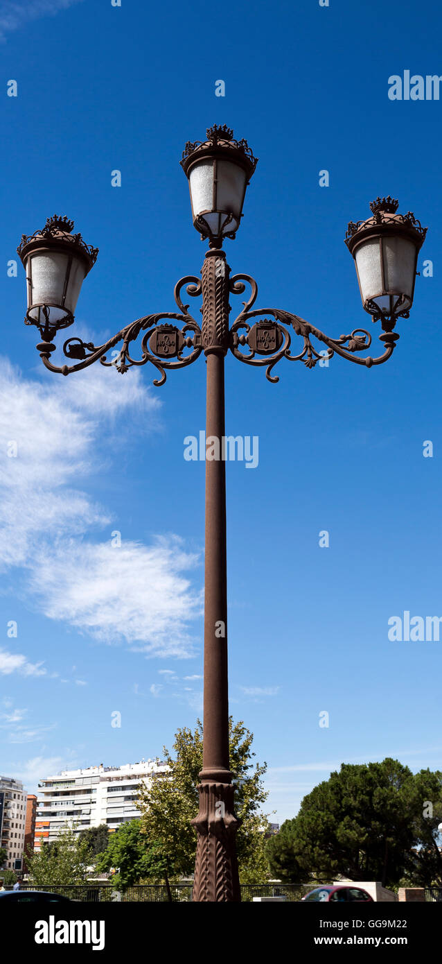 Lamppost of ancient style along many of the old streets of Seville ...