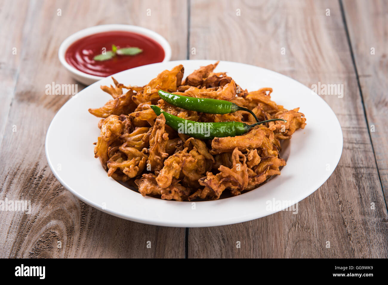 Crispy onion bhaji or kanda bhaji or fried onion pakore or pakode ...