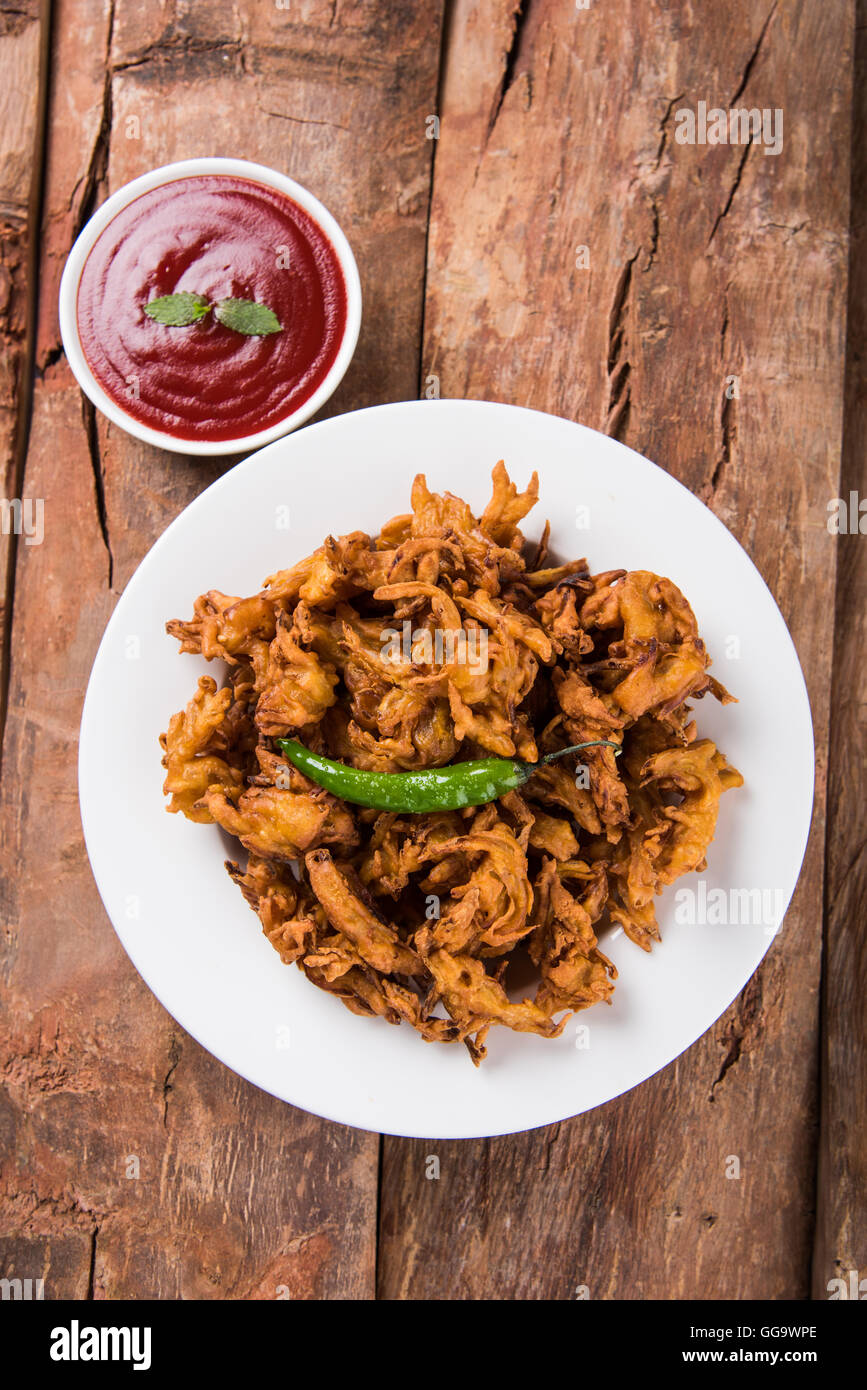 Crispy onion bhaji or kanda bhaji or fried onion pakore or pakode ...
