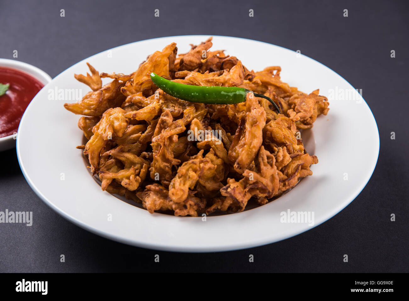 Crispy onion bhaji or kanda bhaji or fried onion pakore or pakode ...