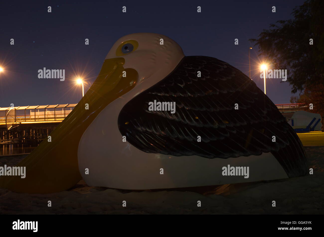 Pelican Slippery Slide in a park at night Stock Photo - Alamy