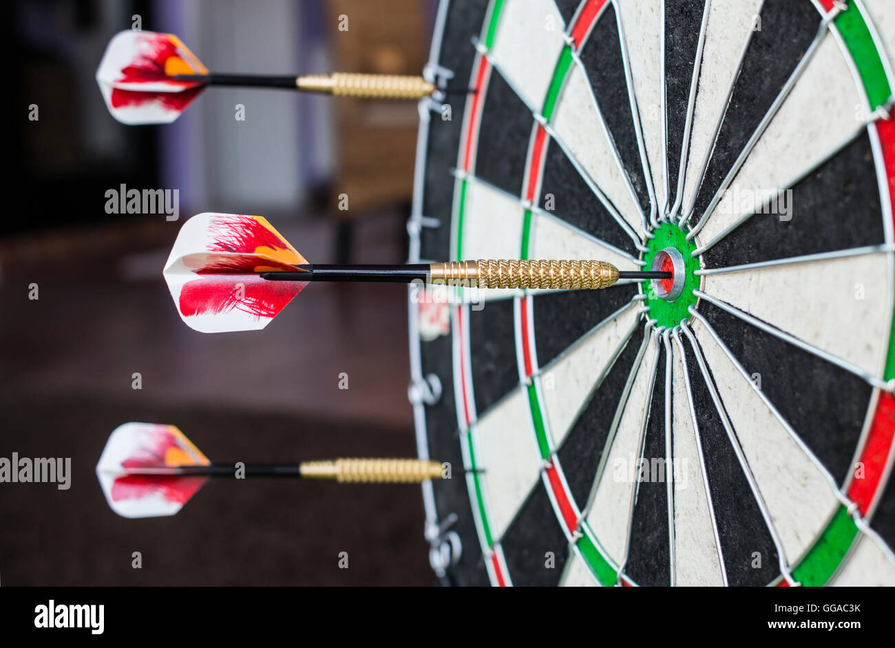A dartboard close-up with a bullseye hits Stock Photo - Alamy