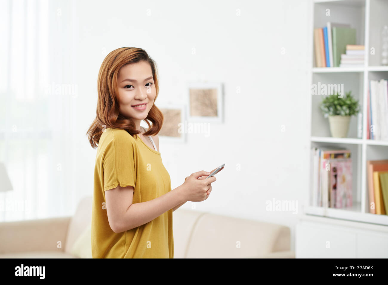 Lovely woman with smartphone Stock Photo - Alamy