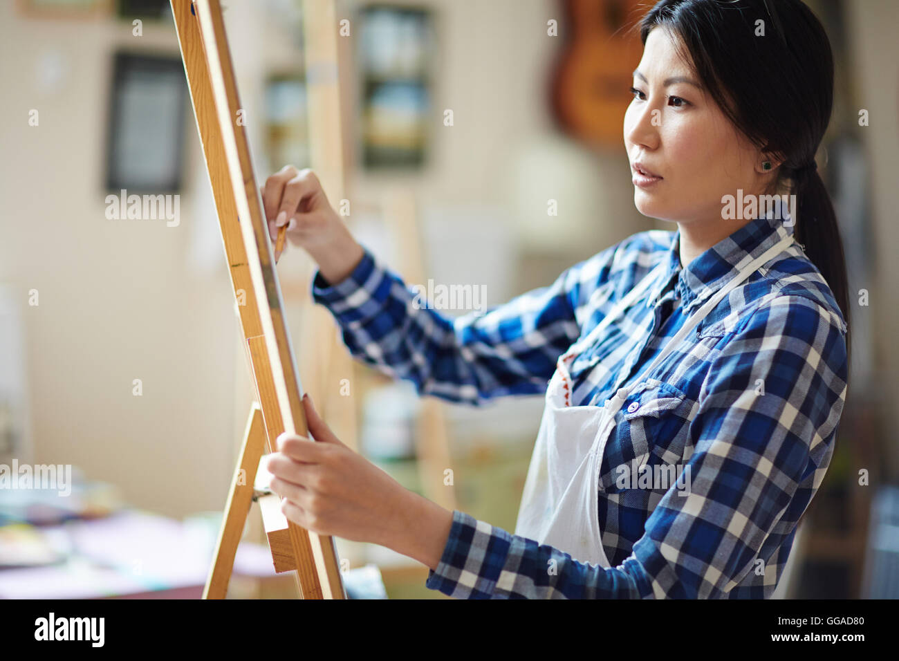 Serious asian woman artist hi-res stock photography and images - Alamy