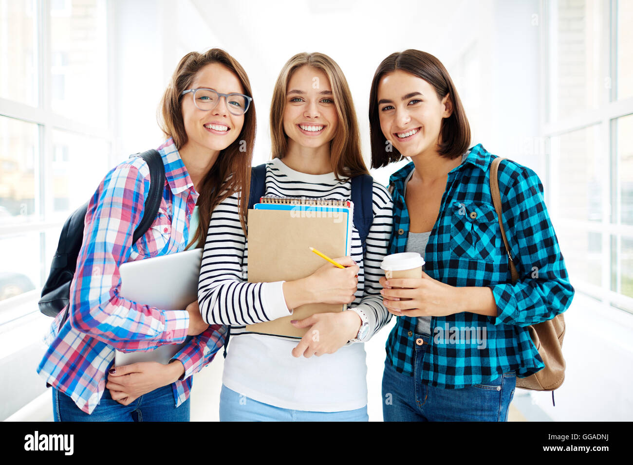 Smiling students standing notebook hi-res stock photography and images ...