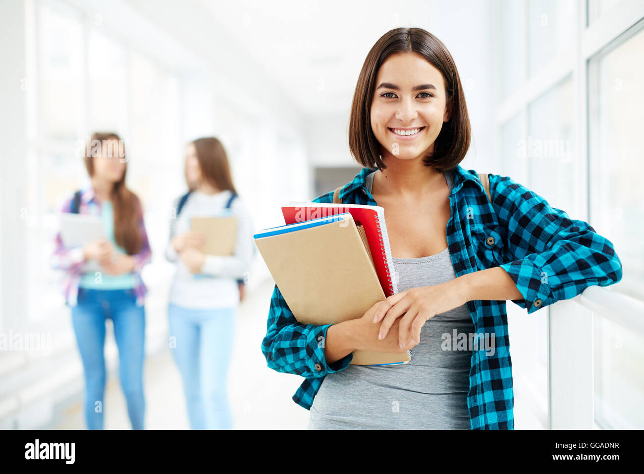 Cheerful female student standing hi-res stock photography and images ...