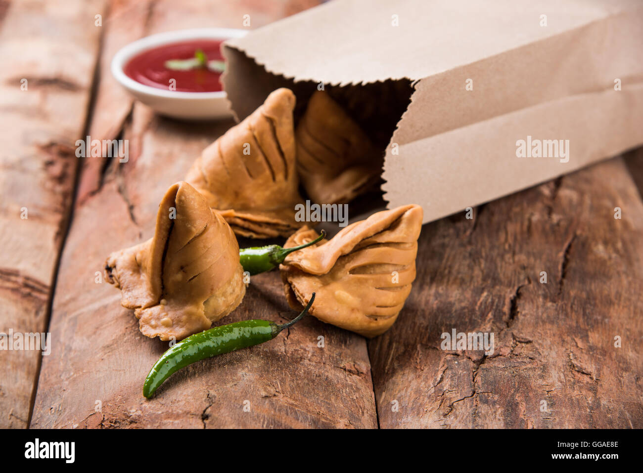 Samosa snack with tomato ketchup and hot tea, Fresh samosas with ...