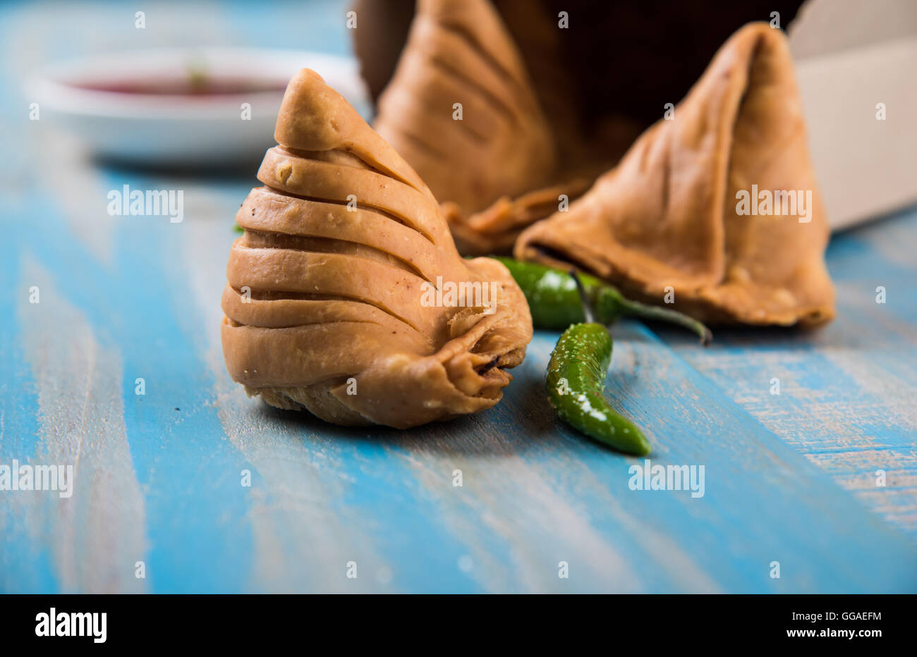 Samosa snack with tomato ketchup and hot tea, Fresh samosas with ...