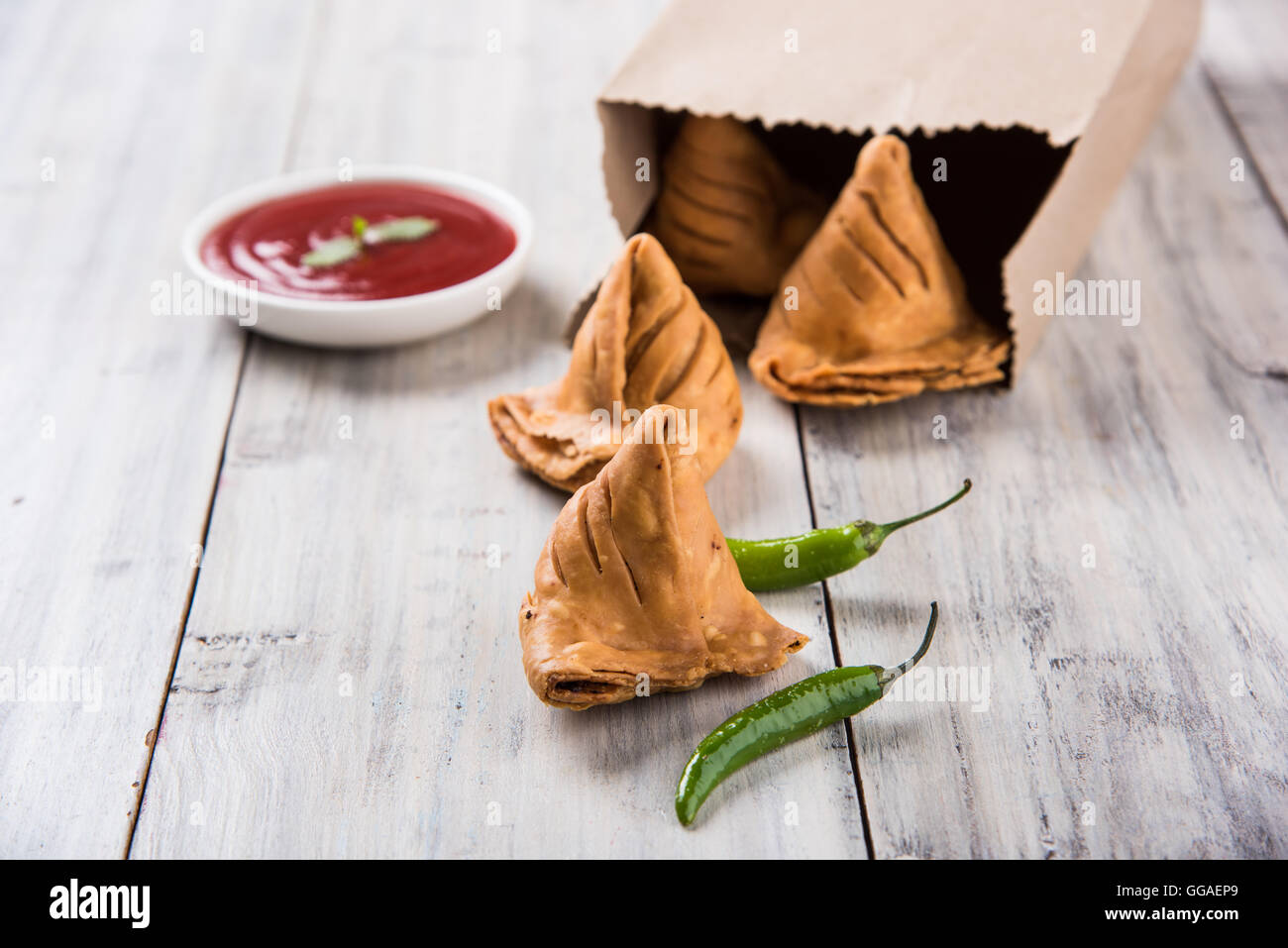 Samosa snack with tomato ketchup and hot tea, Fresh samosas with ...