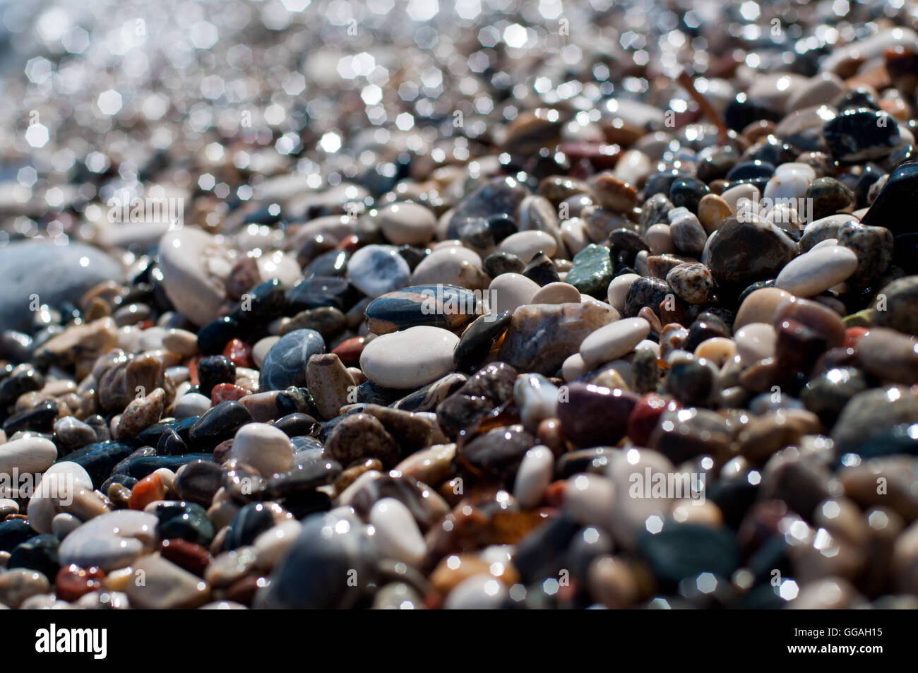 Colored beach pebble with bokeh Stock Photo - Alamy
