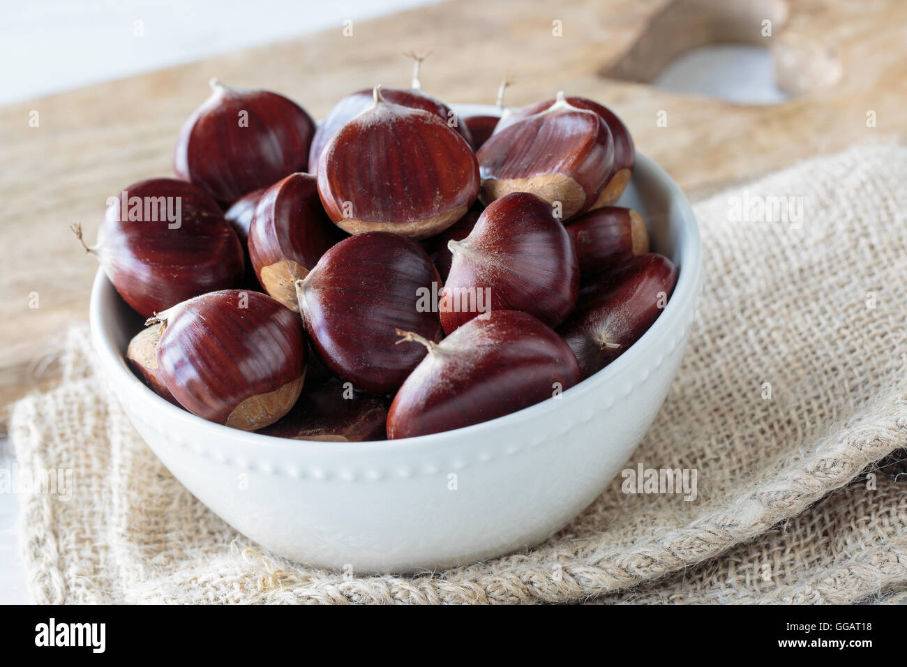 Bunch of fresh raw chestnuts in autumn season Stock Photo - Alamy