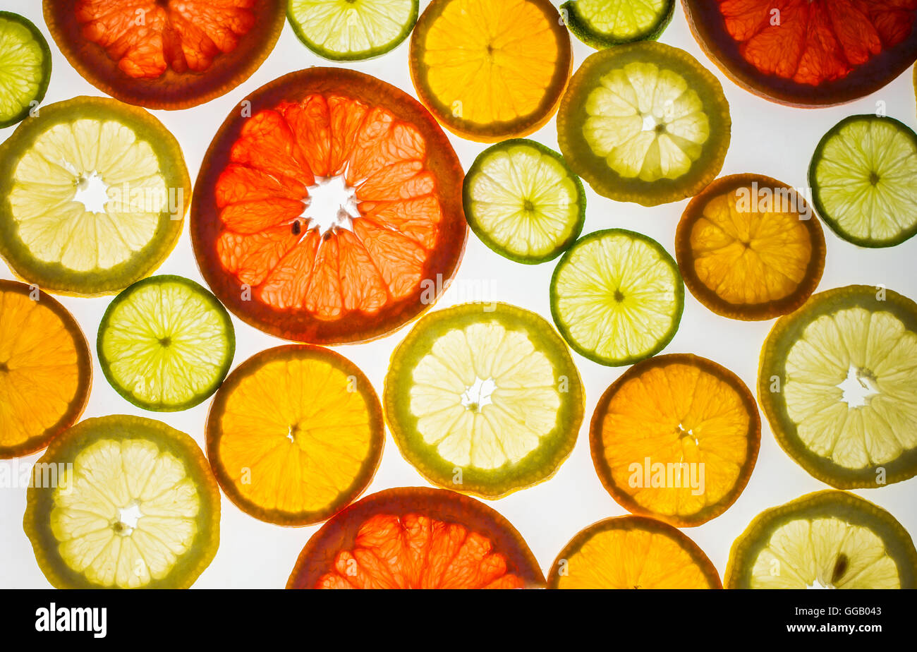 Background of some various colorful citrus slices Stock Photo - Alamy