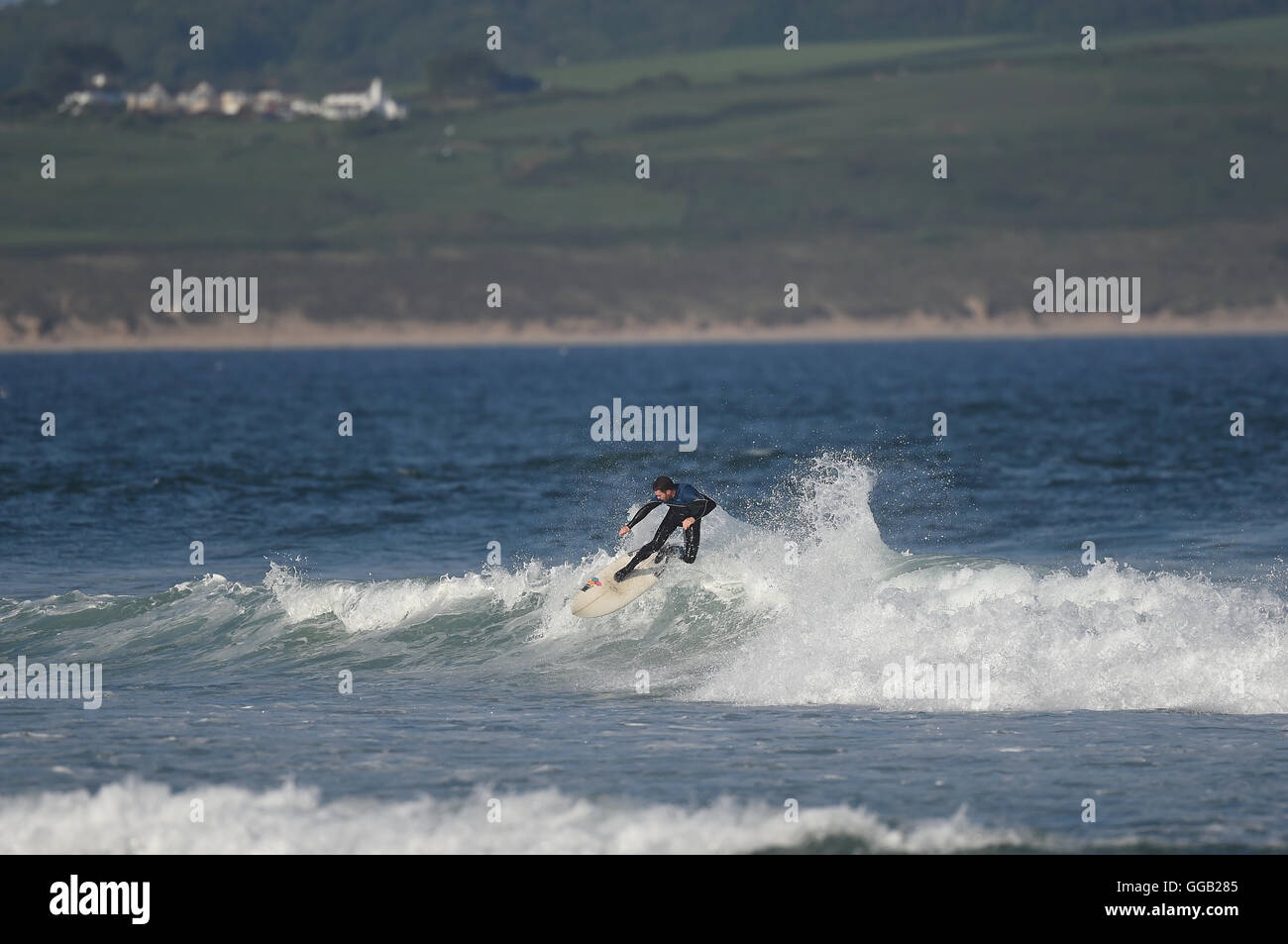 Surfer riding a wave Stock Photo - Alamy
