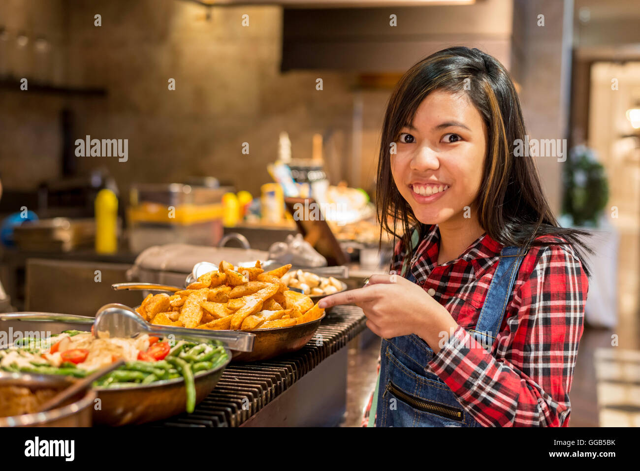 young girl excited in the buffet restaurant Stock Photo - Alamy