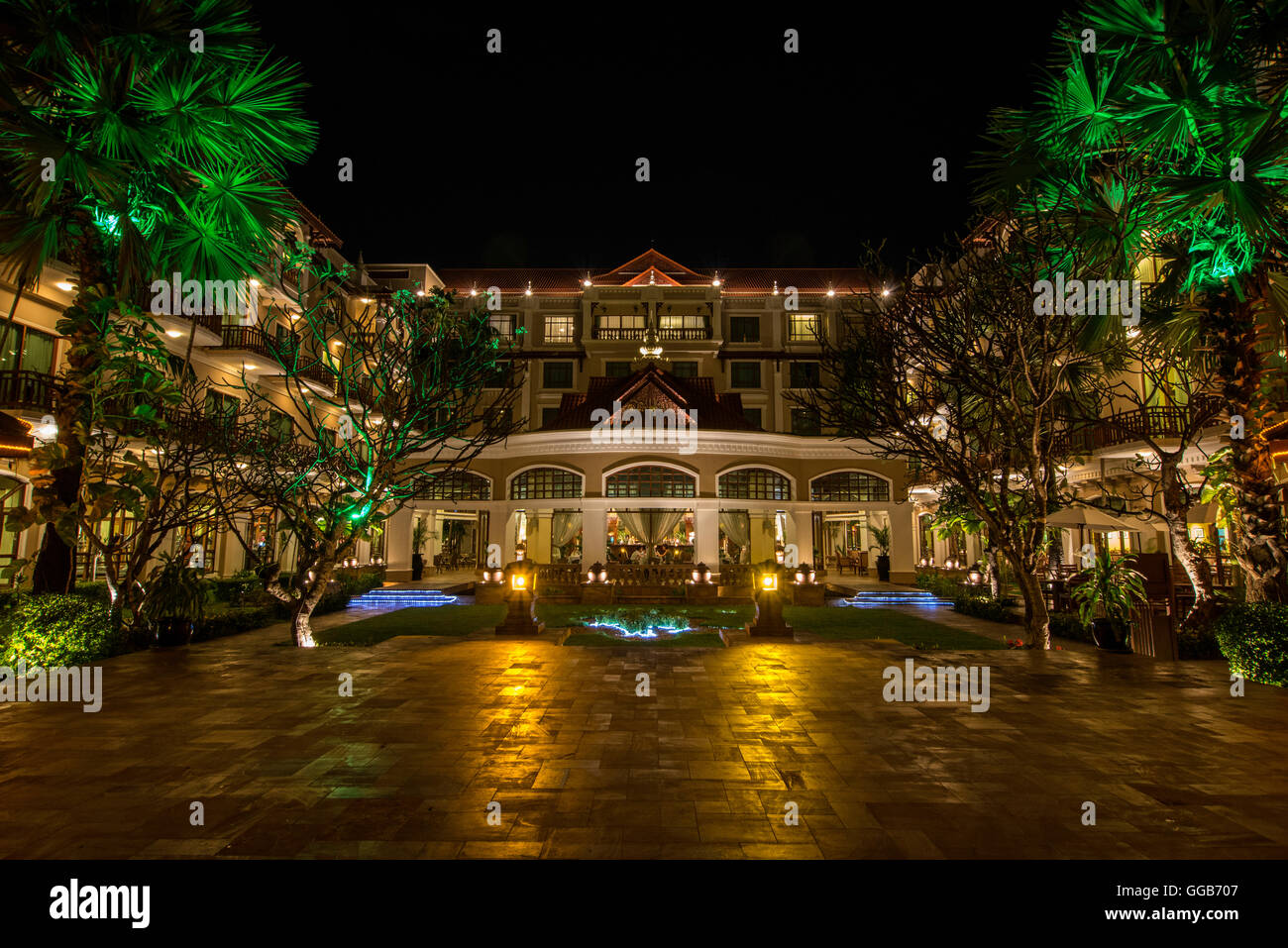 Night at the Hotel Cambodia illuminated courtyard view Stock Photo - Alamy