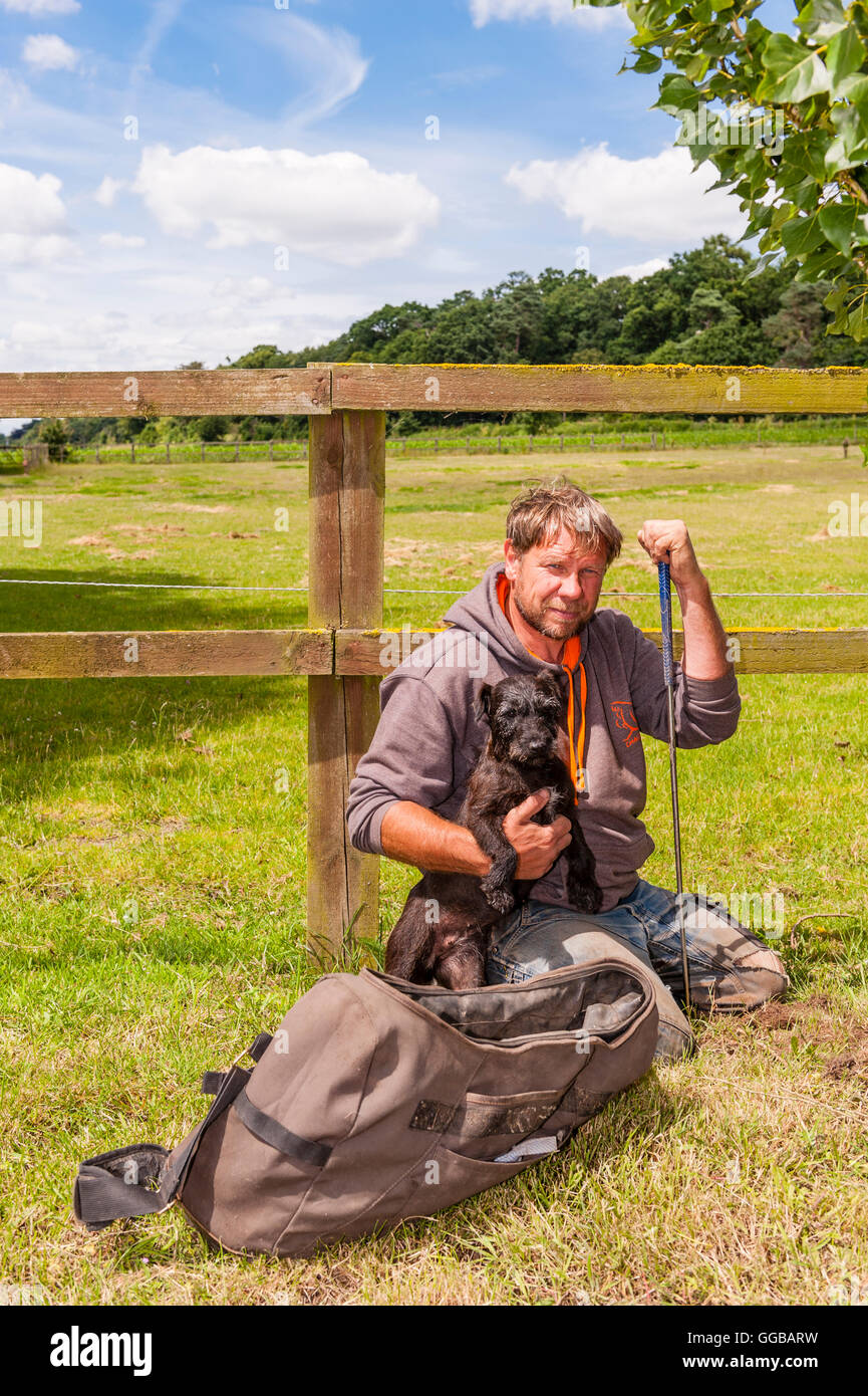 Mark Clark the mole catcher setting mole traps in Suffolk , England ...