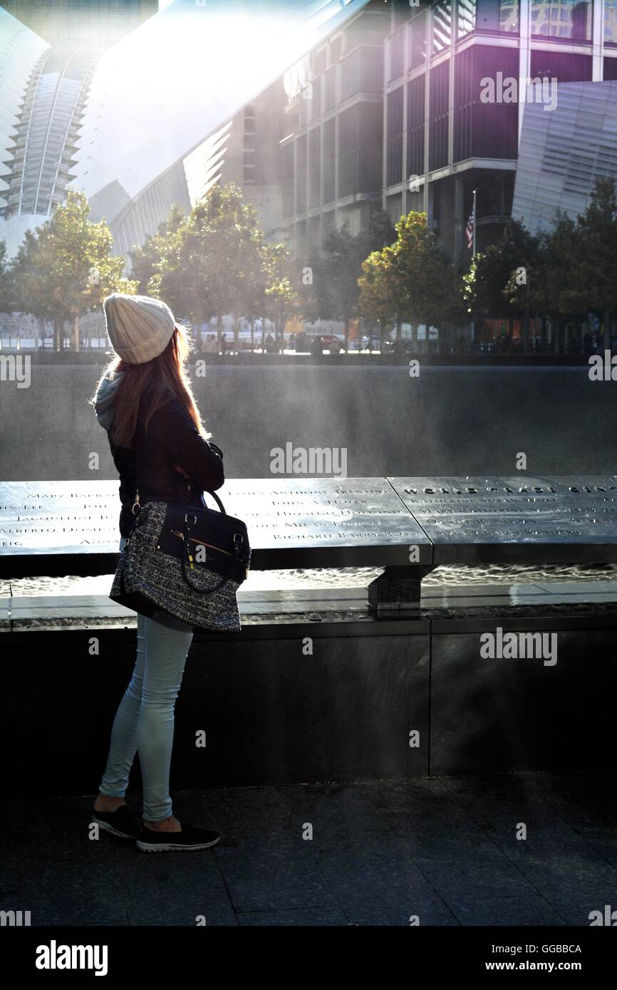 Ground Zero, Girl standing at 9/11 memorial at the World Trade Center ...