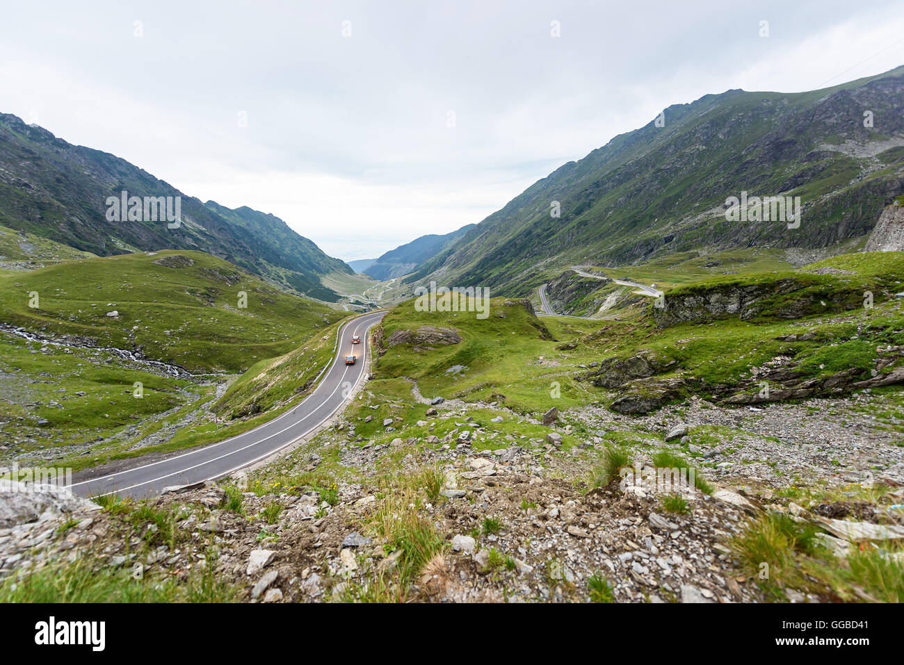 Photo of cars driving on famous winding road in fagaras mountains at ...