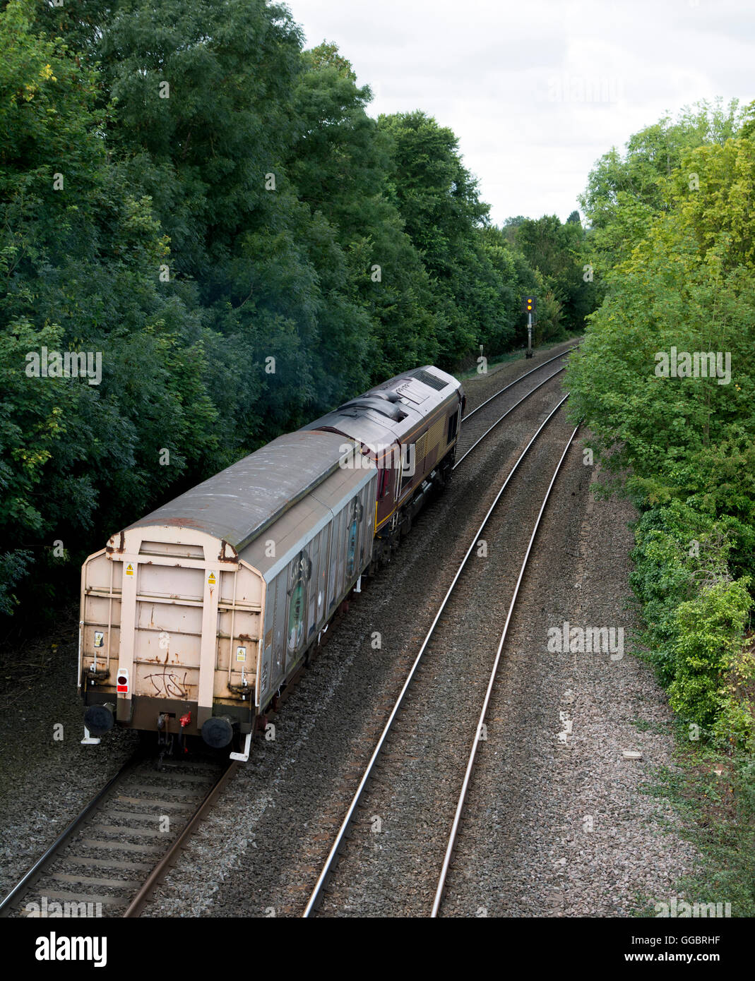 Class 66 diesel locomotive pulling a single ferrywagon freight train ...