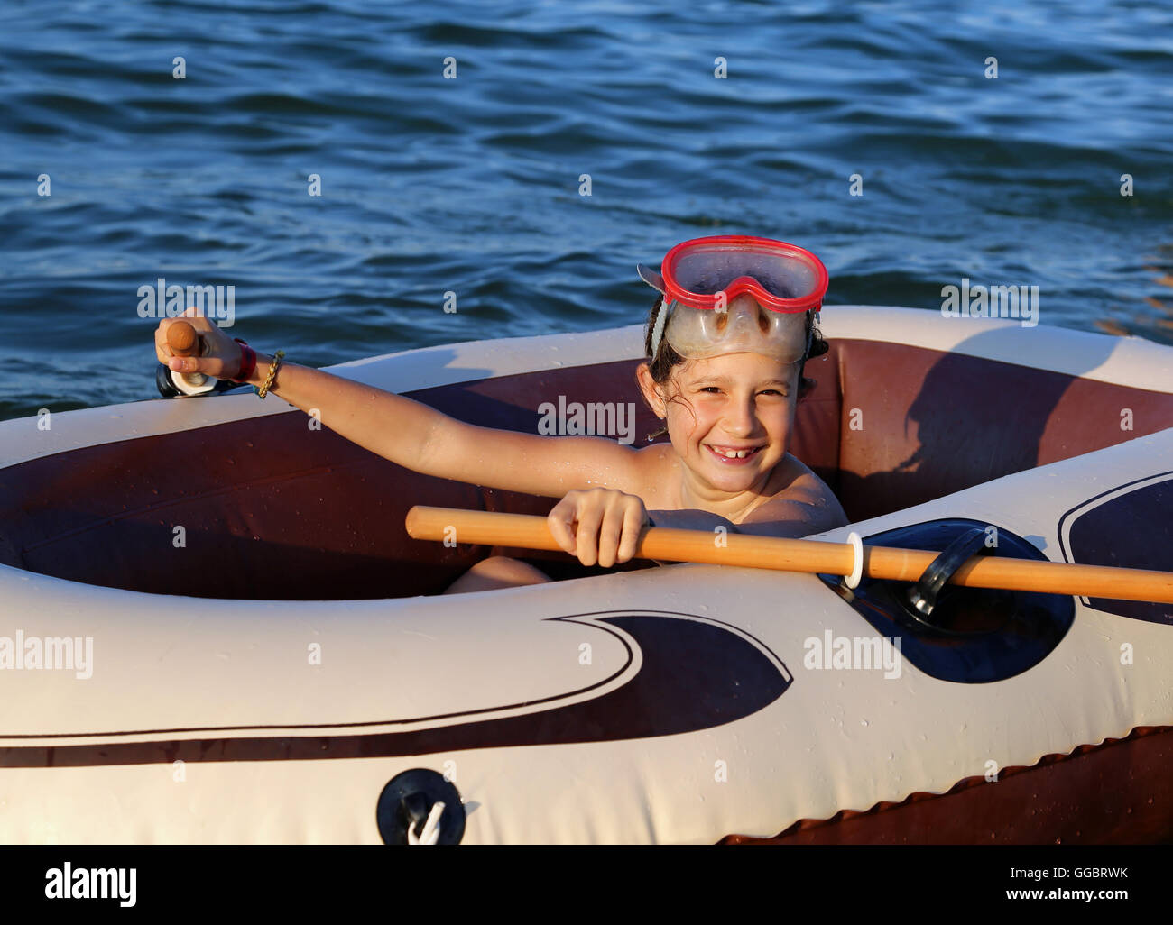 Girl on inflatable boat hi-res stock photography and images - Alamy