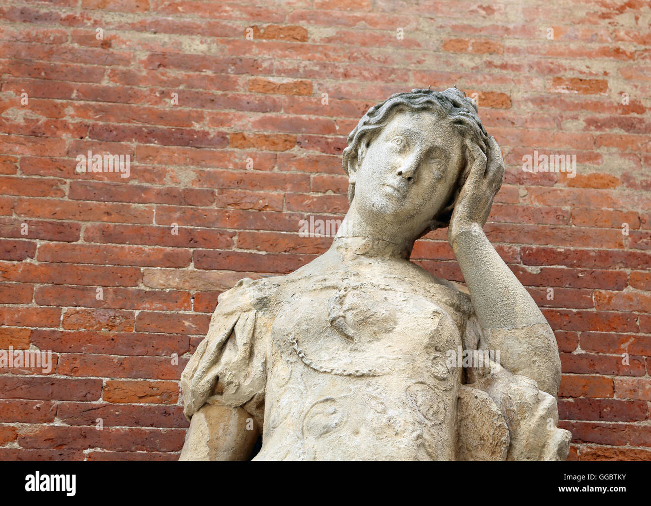 humor ancient statue with his hand resting on the head for headache ...