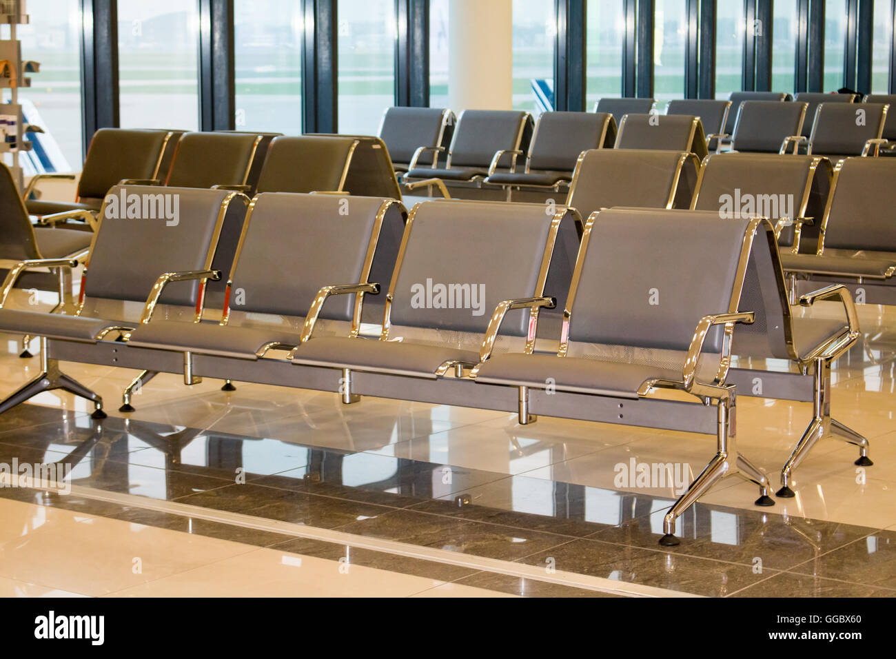 Empty airport terminal waiting area with chairs Stock Photo - Alamy