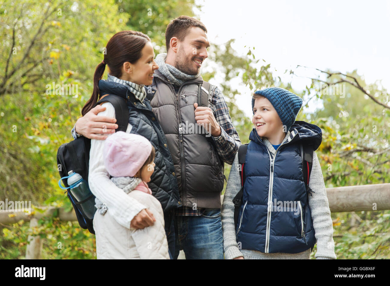 happy family with backpacks hiking Stock Photo - Alamy