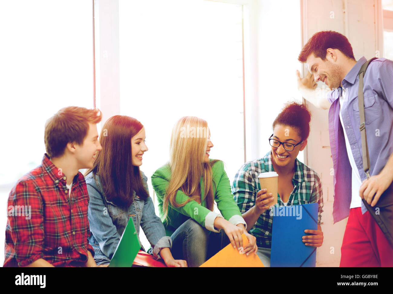 students communicating and laughing at school Stock Photo - Alamy