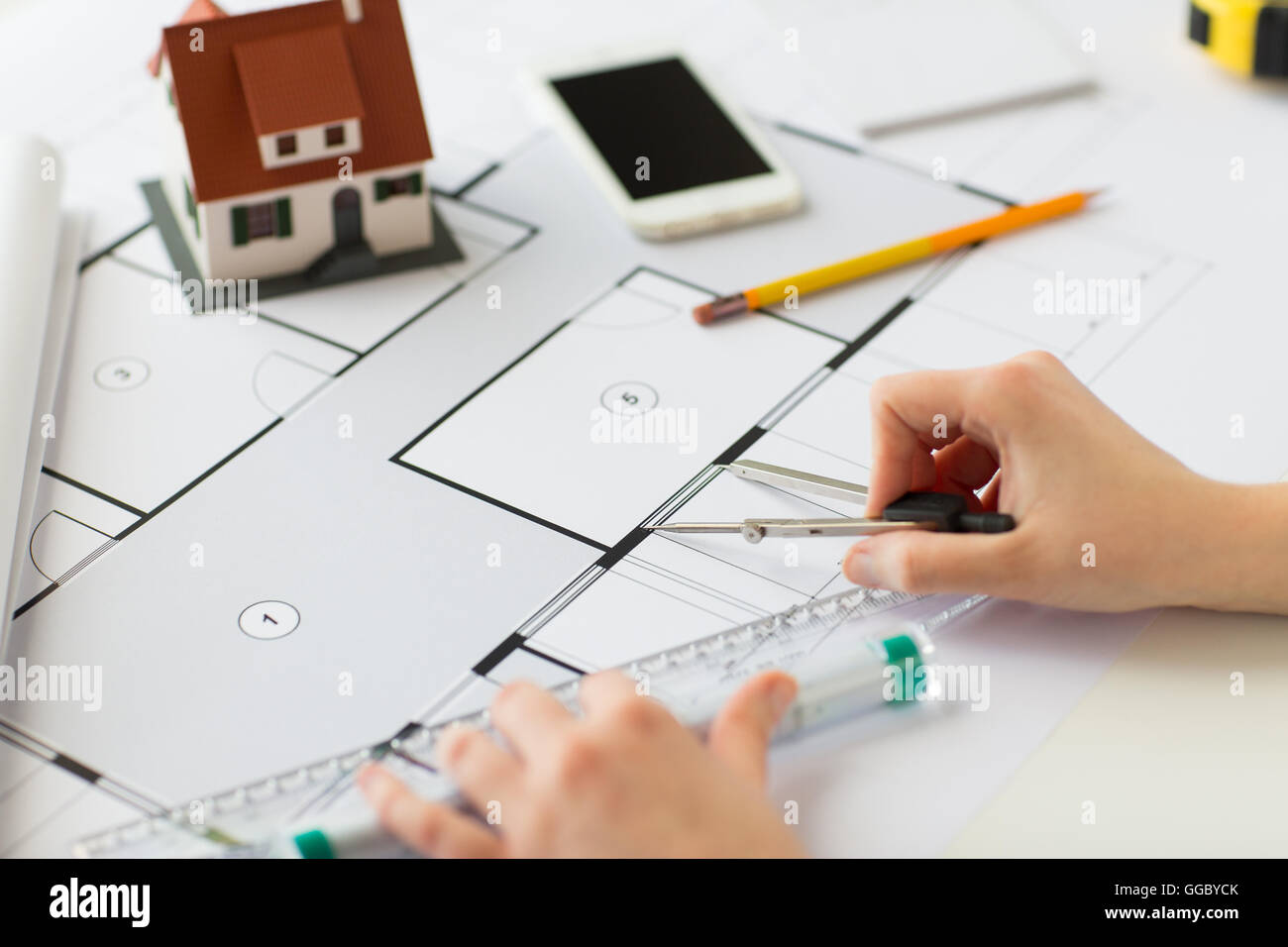 close up of hands with compass measuring blueprint Stock Photo - Alamy